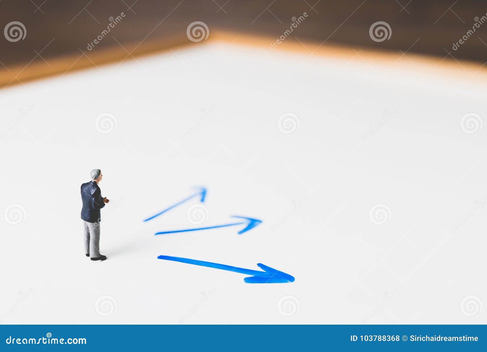 Miniature Businessman Standing on Arrow Pathway Stock Photo - Image of ... Miniature Businessman Standing on Arrow Pathway Stock Photo - Image of ...