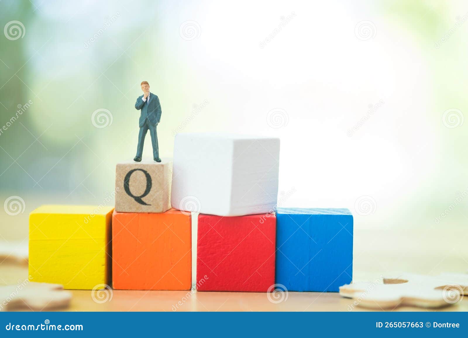 Miniature Businessman Thinking and Standing on Q. the Concept of ...