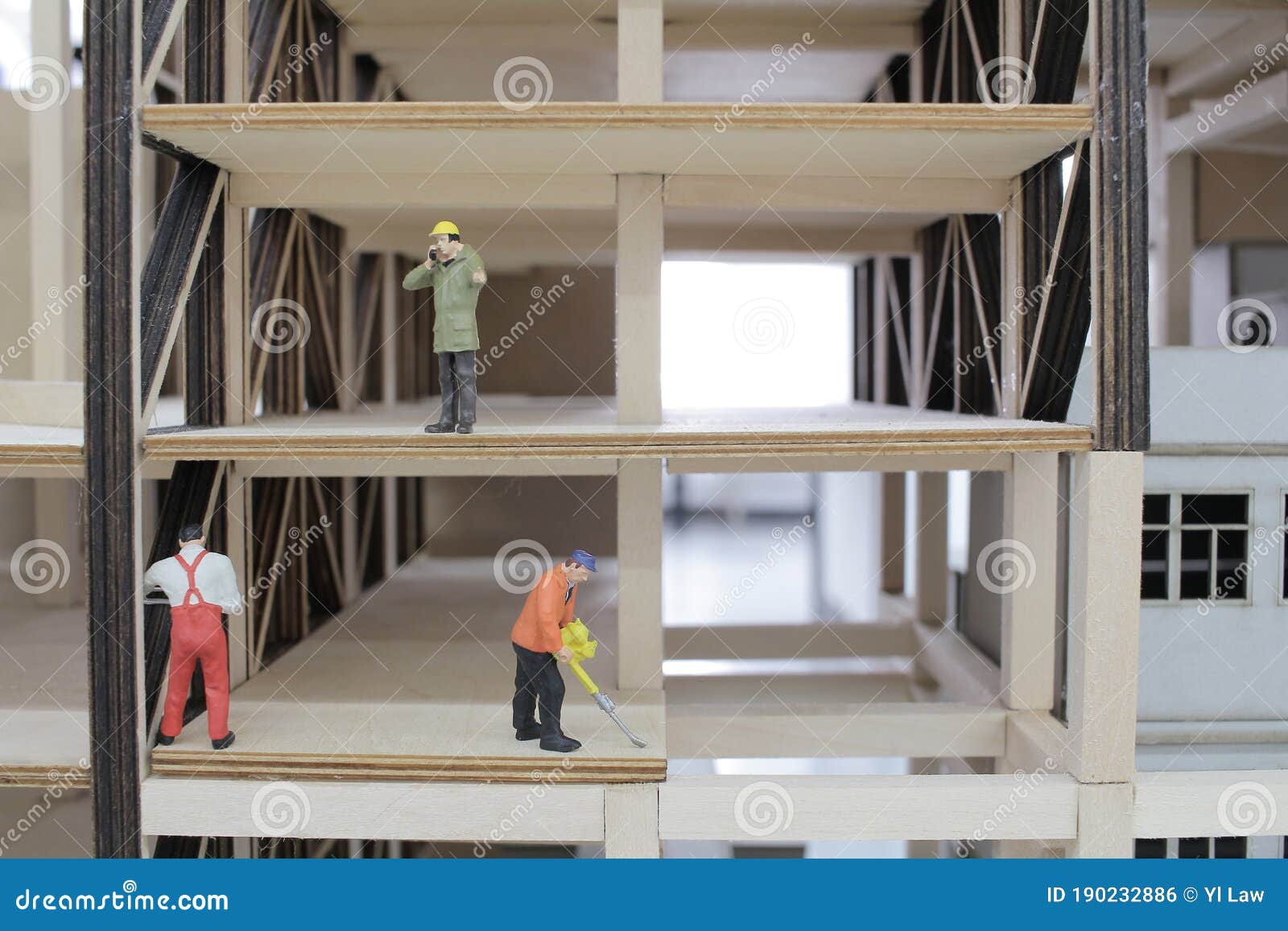 The Miniature Construction Workers Building Plans Stock Photo - Image ...