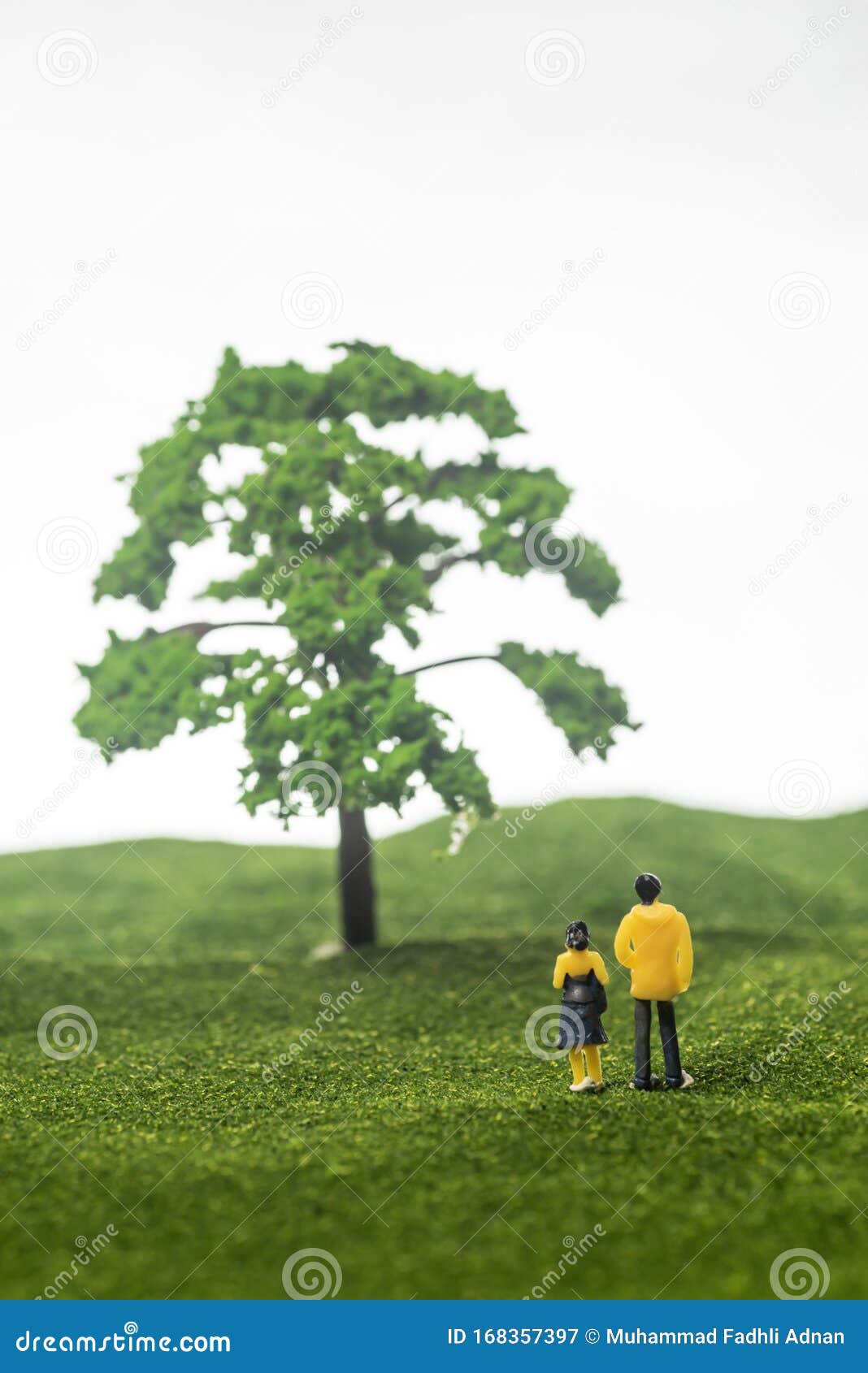 Miniature Couple Figures in Front of a Tree Stock Image - Image of ...