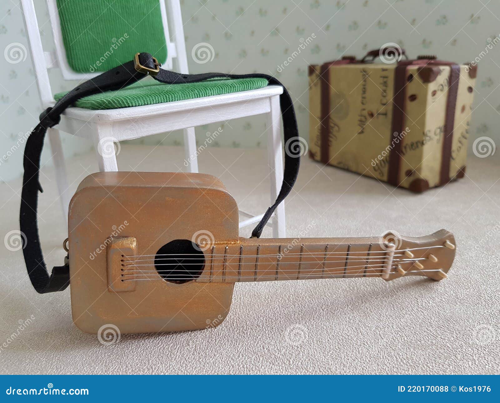 Miniature Puppet Guitar Lies on a Puppet Chair Stock Photo - Image of ...