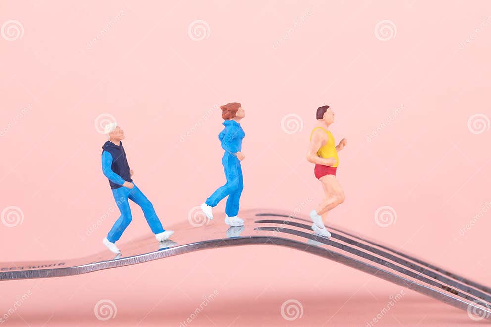 Miniature Doll Model Running on a Fork Stock Image - Image of exercise ...