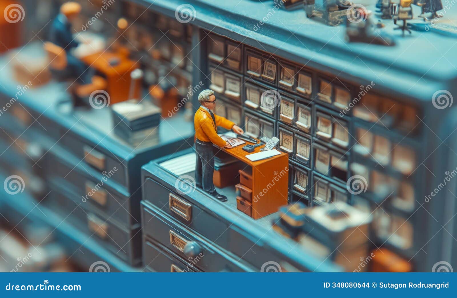 Miniature Employees Setting Up Tiny Offices Inside the Drawers of a ...