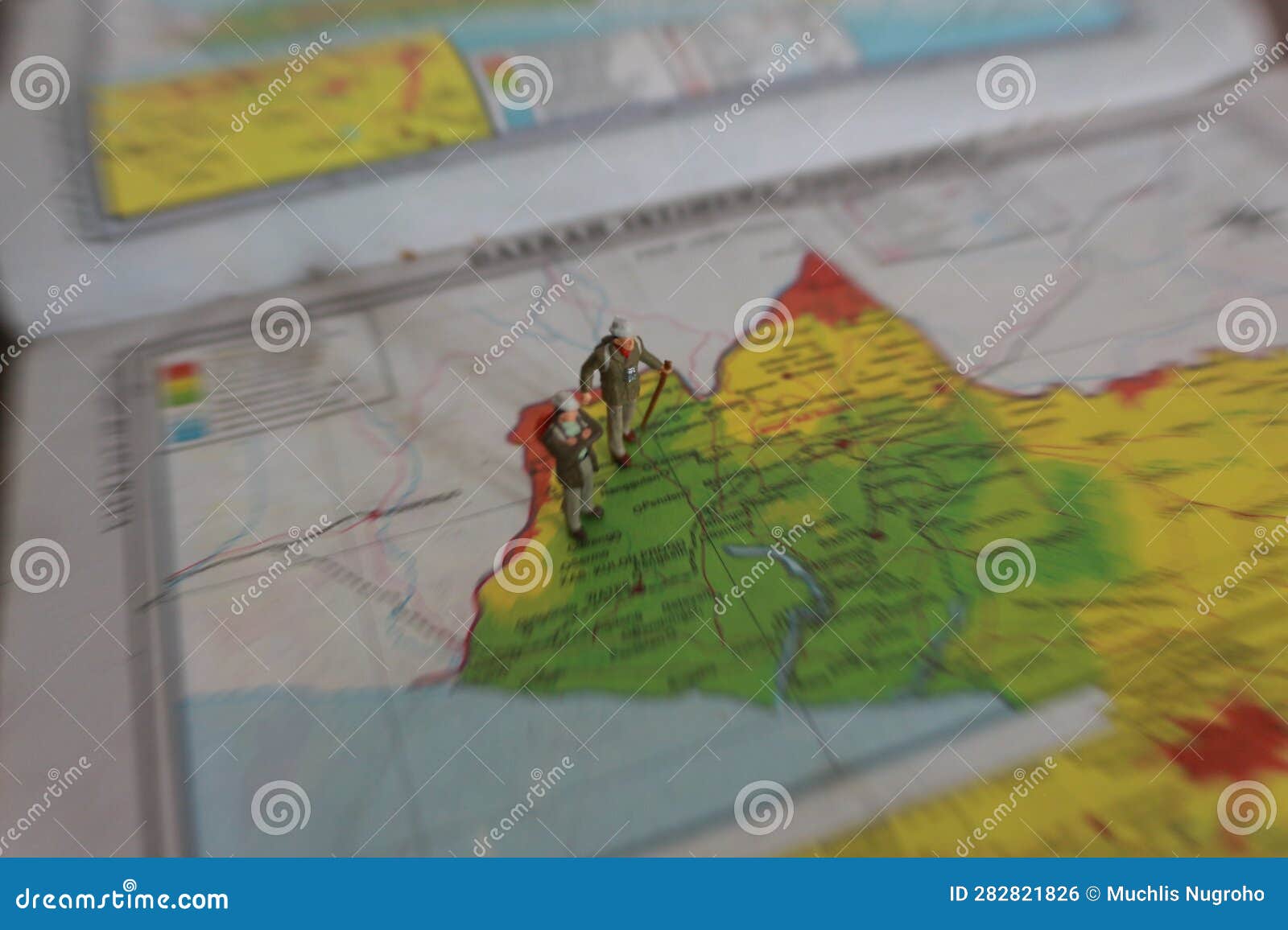 Miniature Figure of an Explorer Posing on a Map or Atlas Stock Photo ...