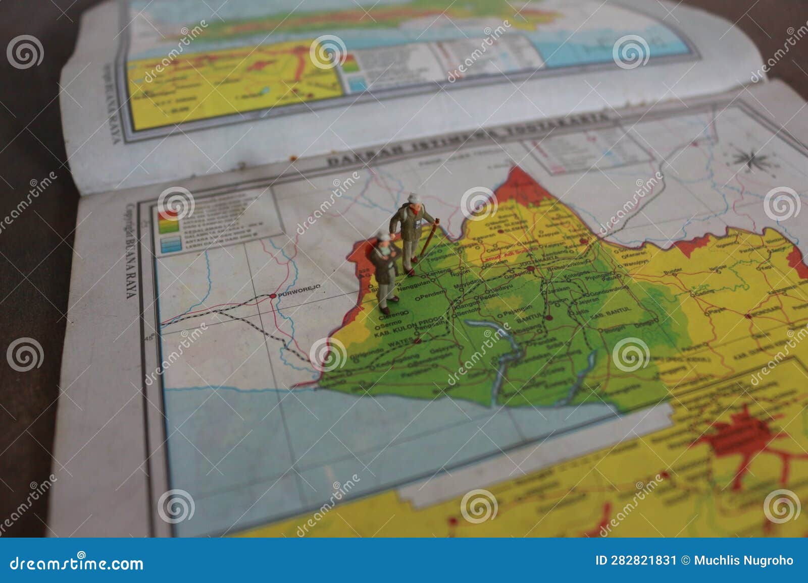 Miniature Figure of an Explorer Posing on a Map or Atlas Stock Image ...