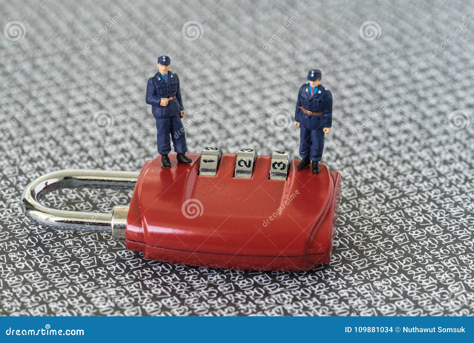 Miniature Figure Security Guards Standing on Red Combination Pad Stock ...