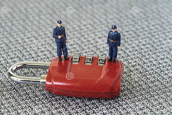 Miniature Figure Security Guards Standing on Red Combination Pad Stock ...
