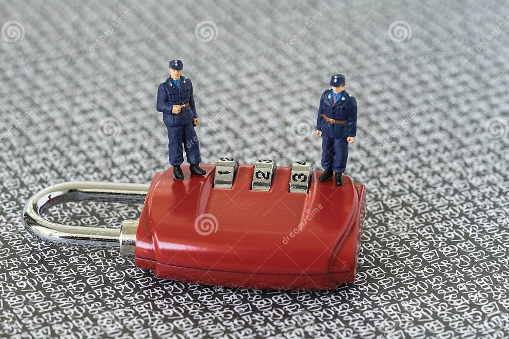 Miniature Figure Security Guards Standing on Red Combination Pad Stock ...