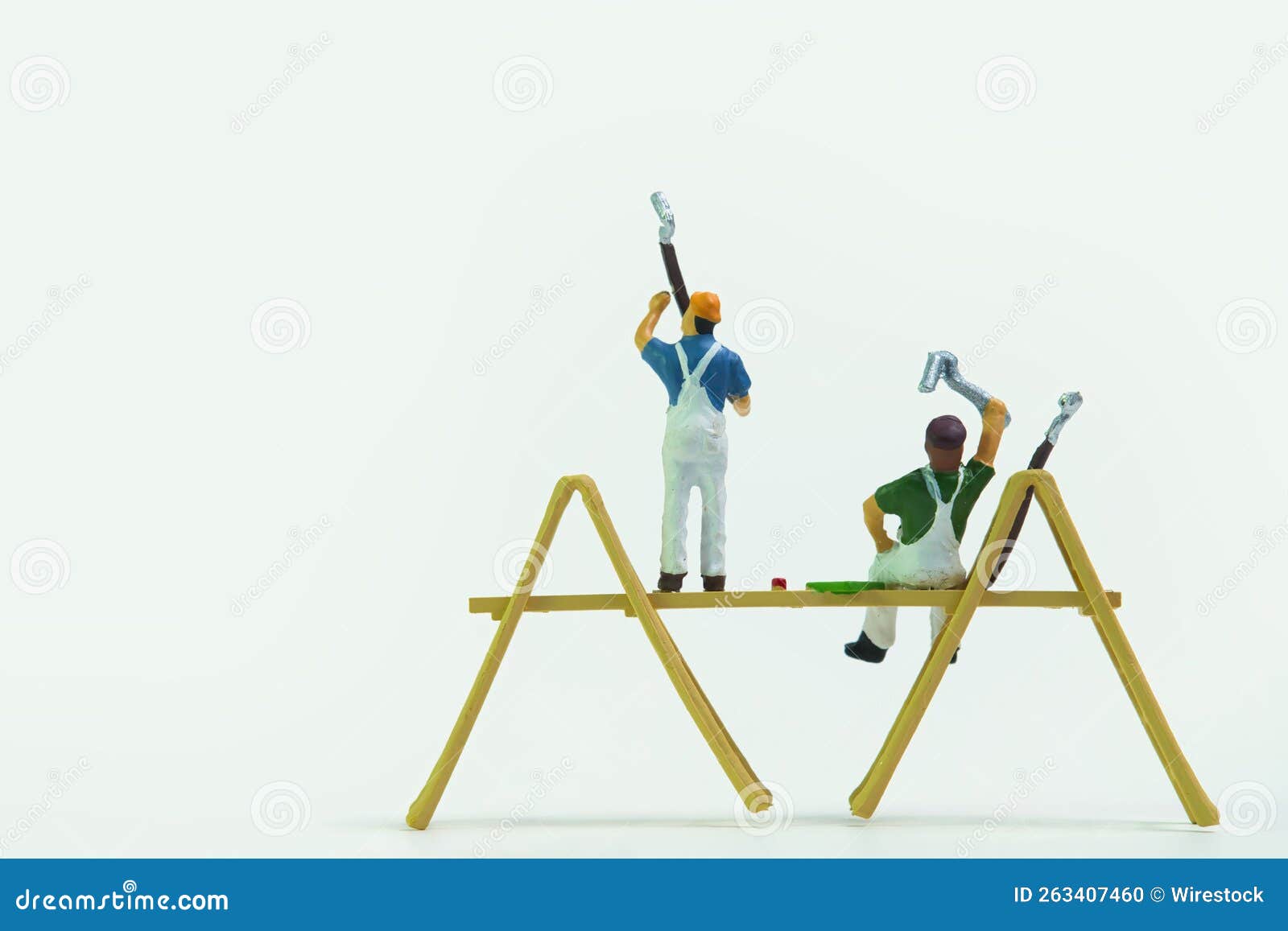 Miniature Figures of Construction Workers Painting the Walls on a White ...