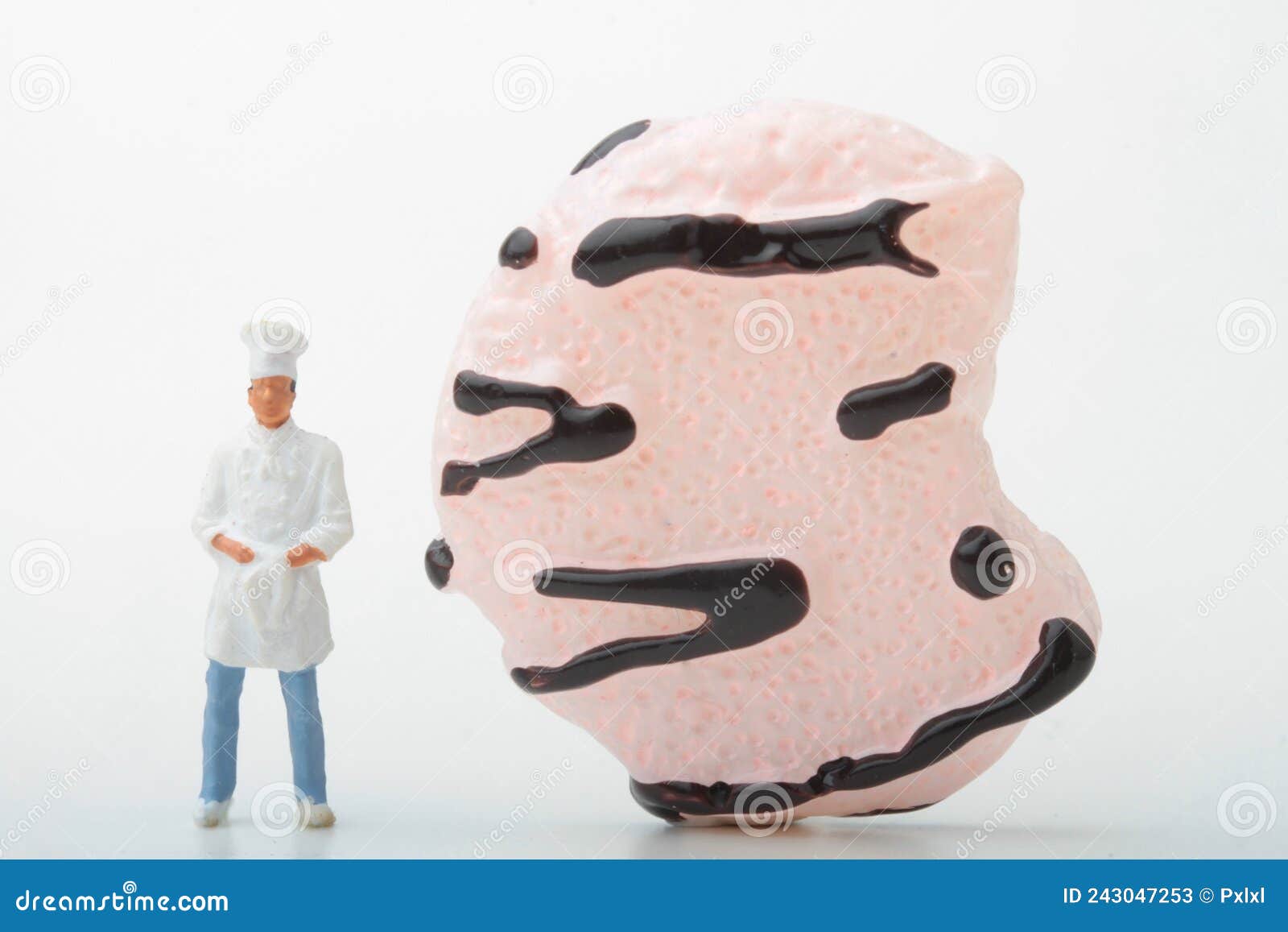 Miniature Figurine of a Chef with a Giant Chocolate Cookie Stock Image ...