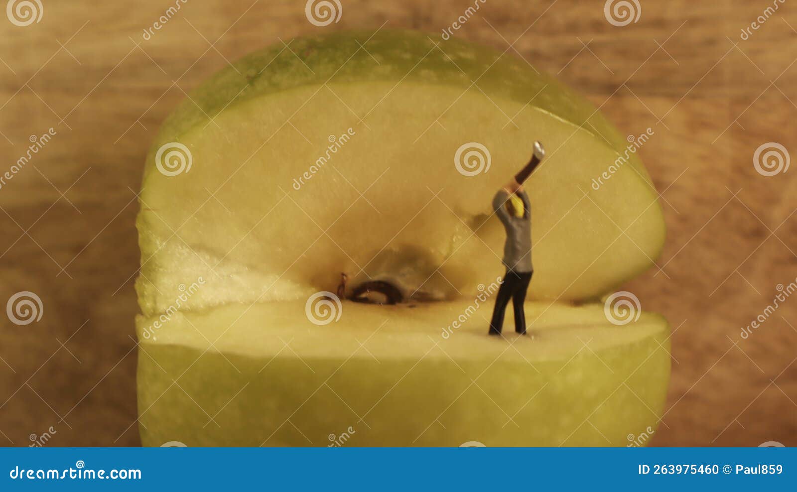 Miniature Figurine Cutting an Apple Stock Photo - Image of figurine ...
