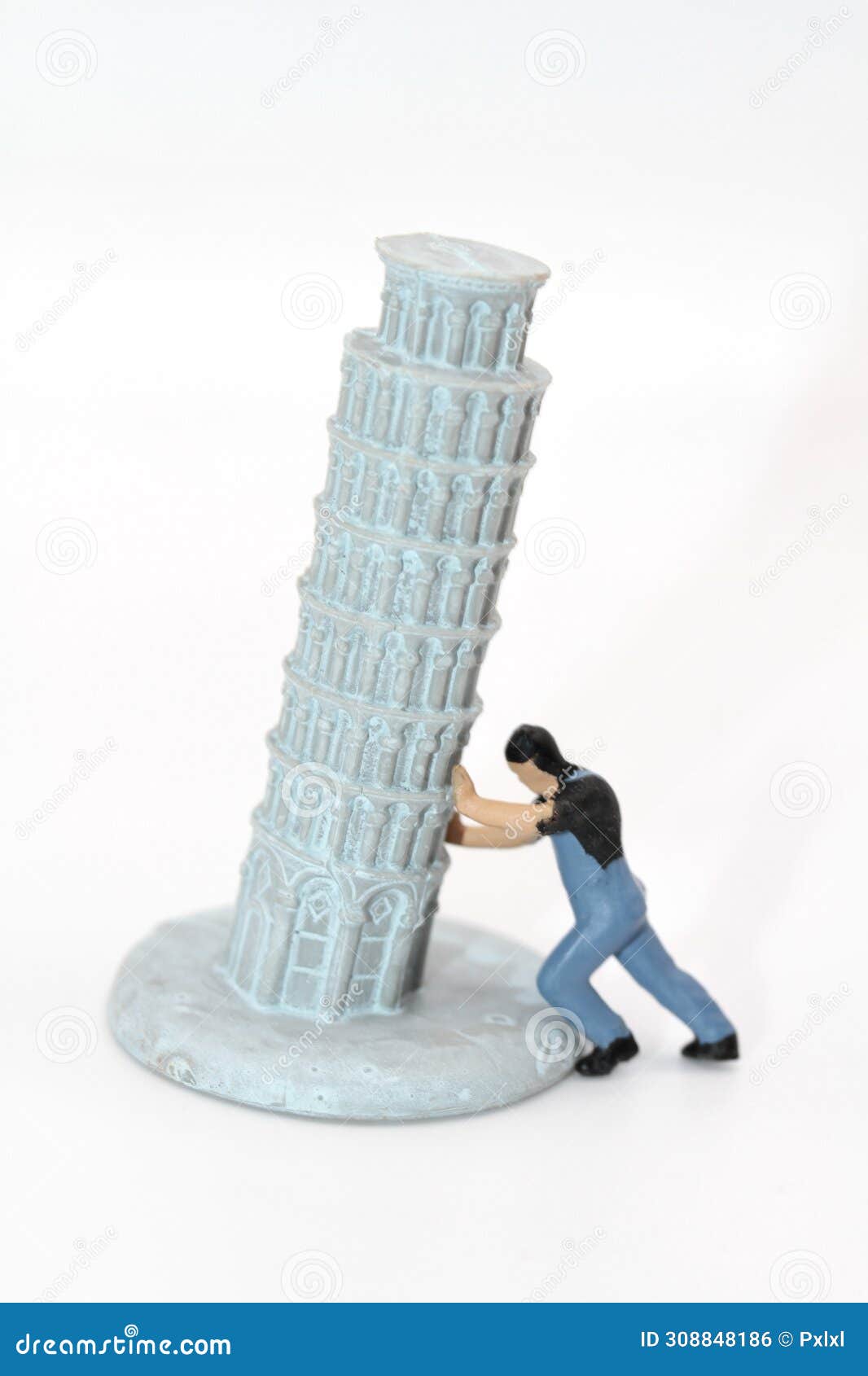 Miniature Figurine of a Man Pushing the Tower of Pisa Stock Photo ...