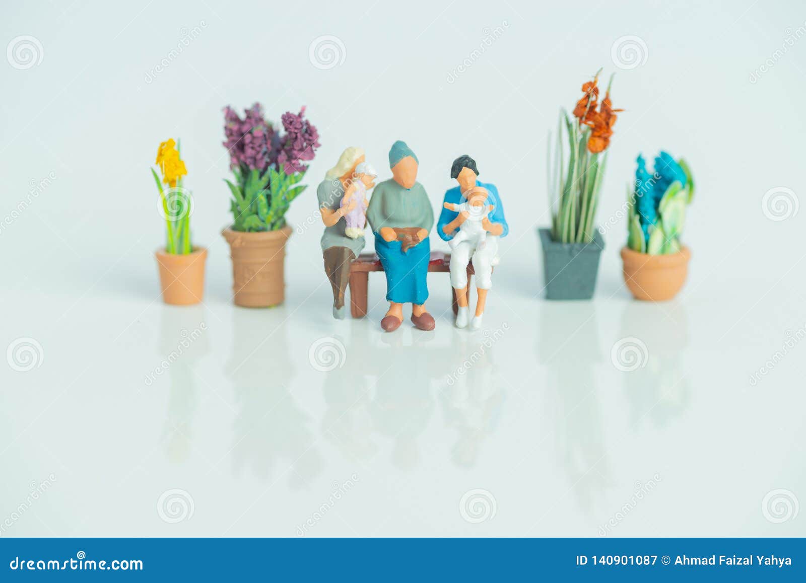 Miniature Figurines - 3 Generations of People on White Background Stock ...