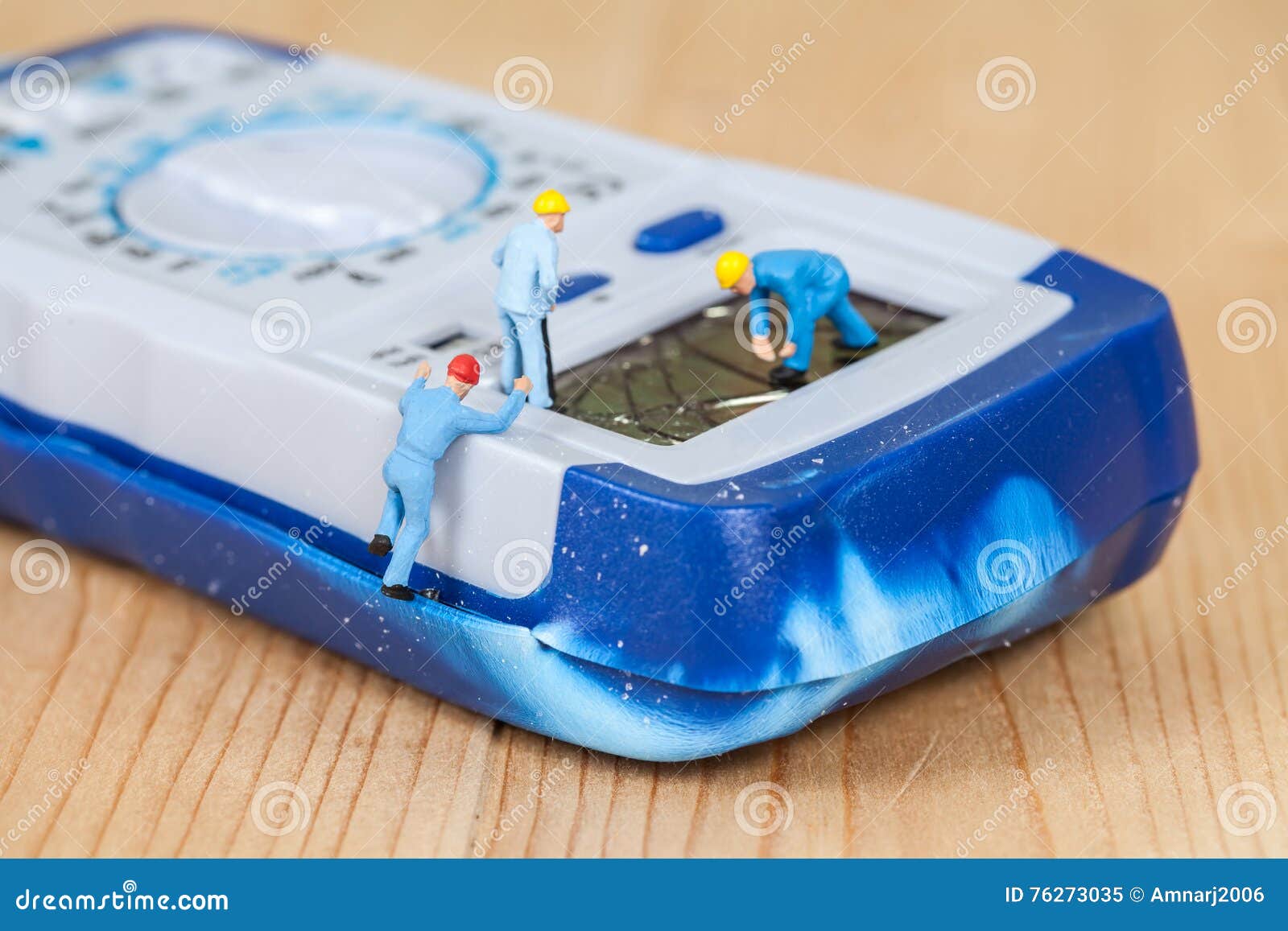 Miniature Maintenance Team Repairing A Broken Multimeter Stock ...