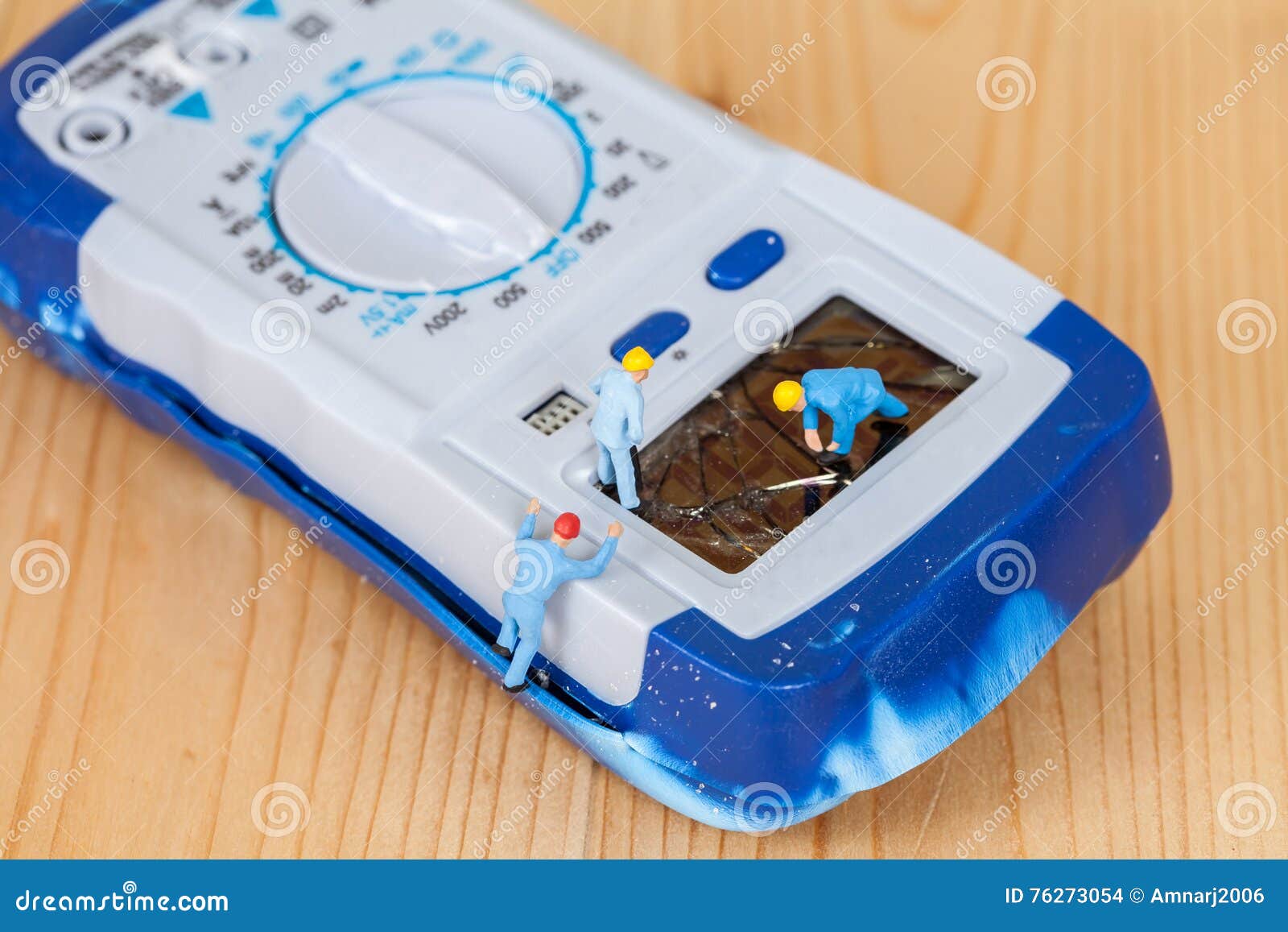 Miniature Maintenance Team Repairing a Broken Multimeter Stock Photo ...