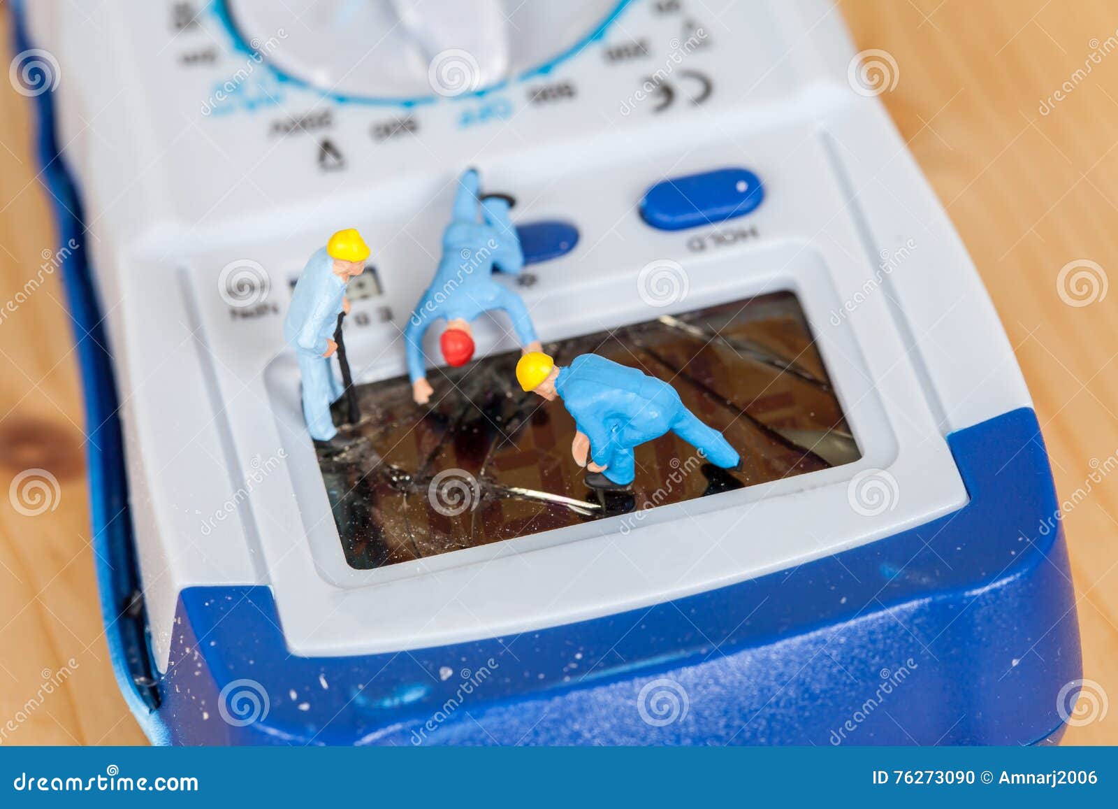 Miniature Maintenance Team Repairing a Broken Multimeter Stock Photo ...