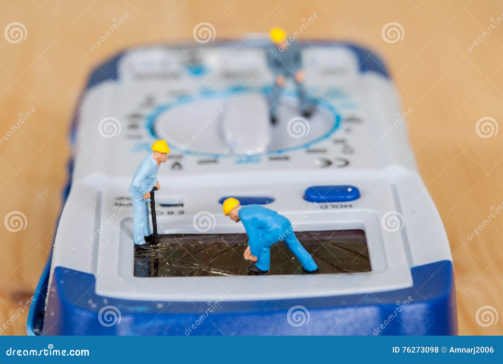 Miniature Maintenance Team Repairing A Broken Multimeter Stock Photo ...