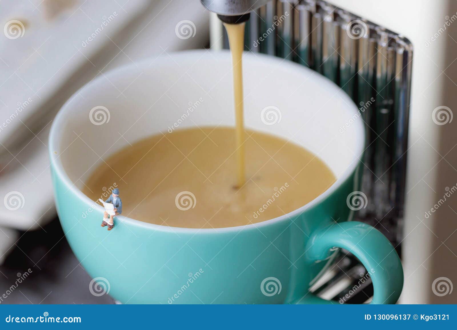 Miniature Man Sitting at the Edge of a Cup Stock Image - Image of ...