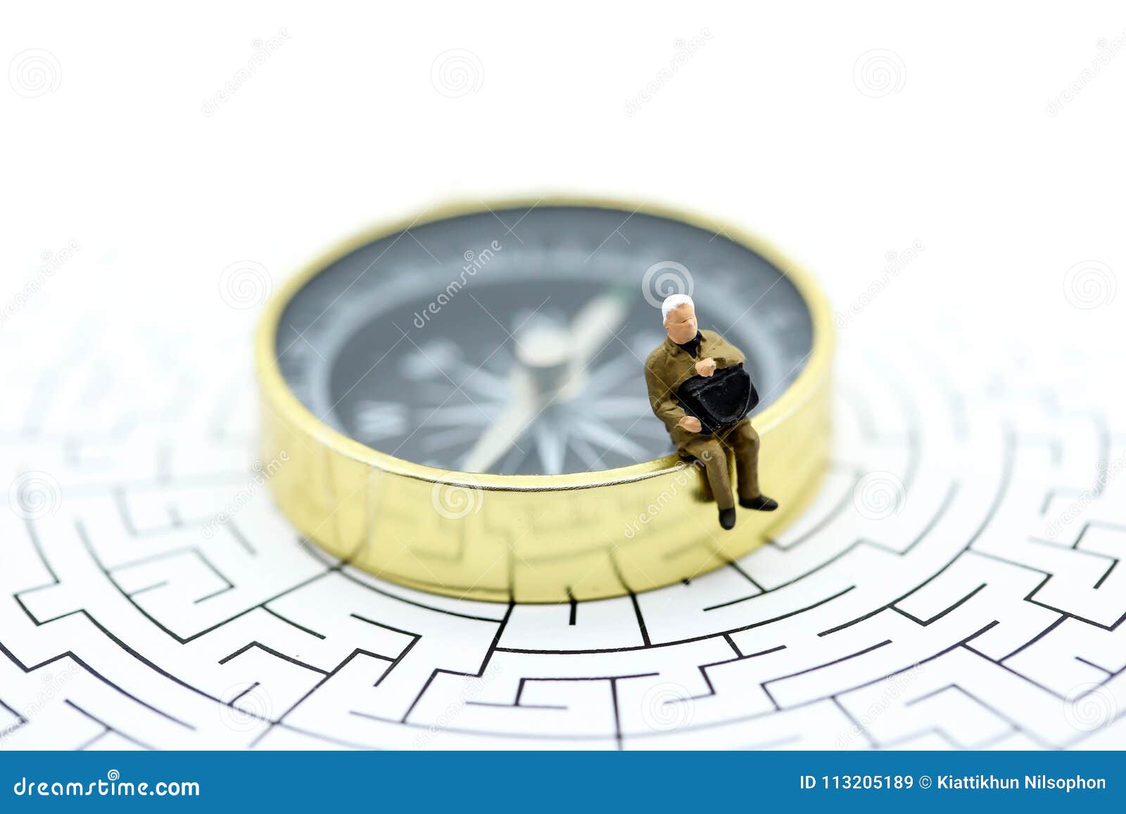 Miniature People : Businessman Sitting on Compass with Maze,Co Stock ...