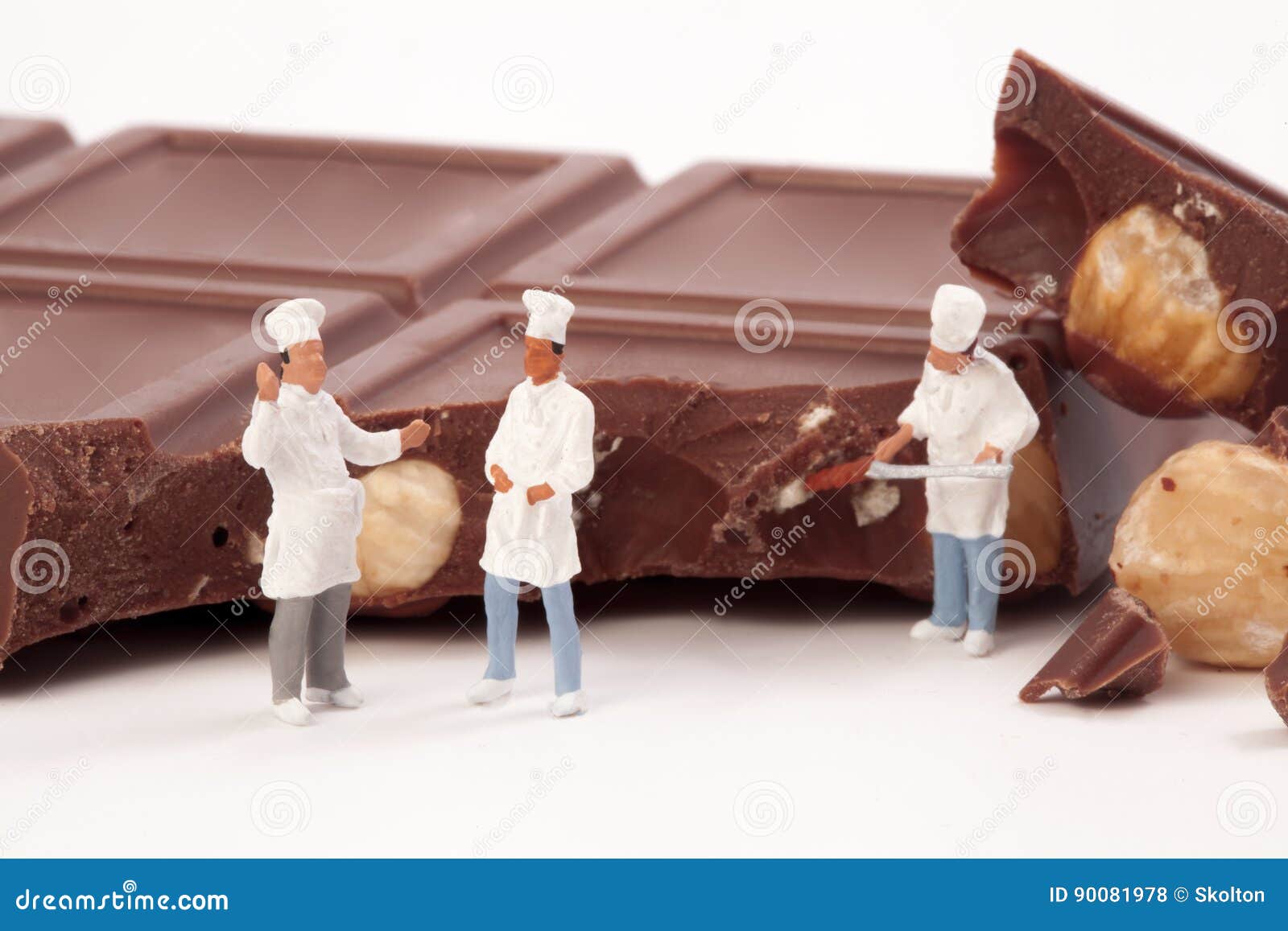 Miniature People: a Chef and Cooks in Front of a Chocolate Bar Stock ...