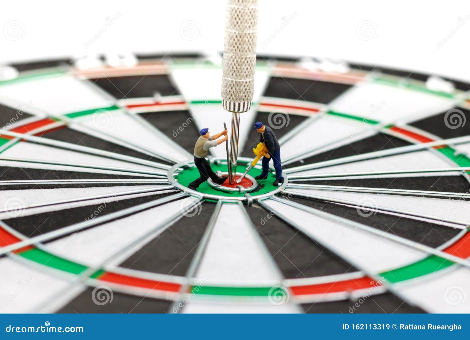 Miniature People Digging the Arrow in the Middle of the Target To the ...