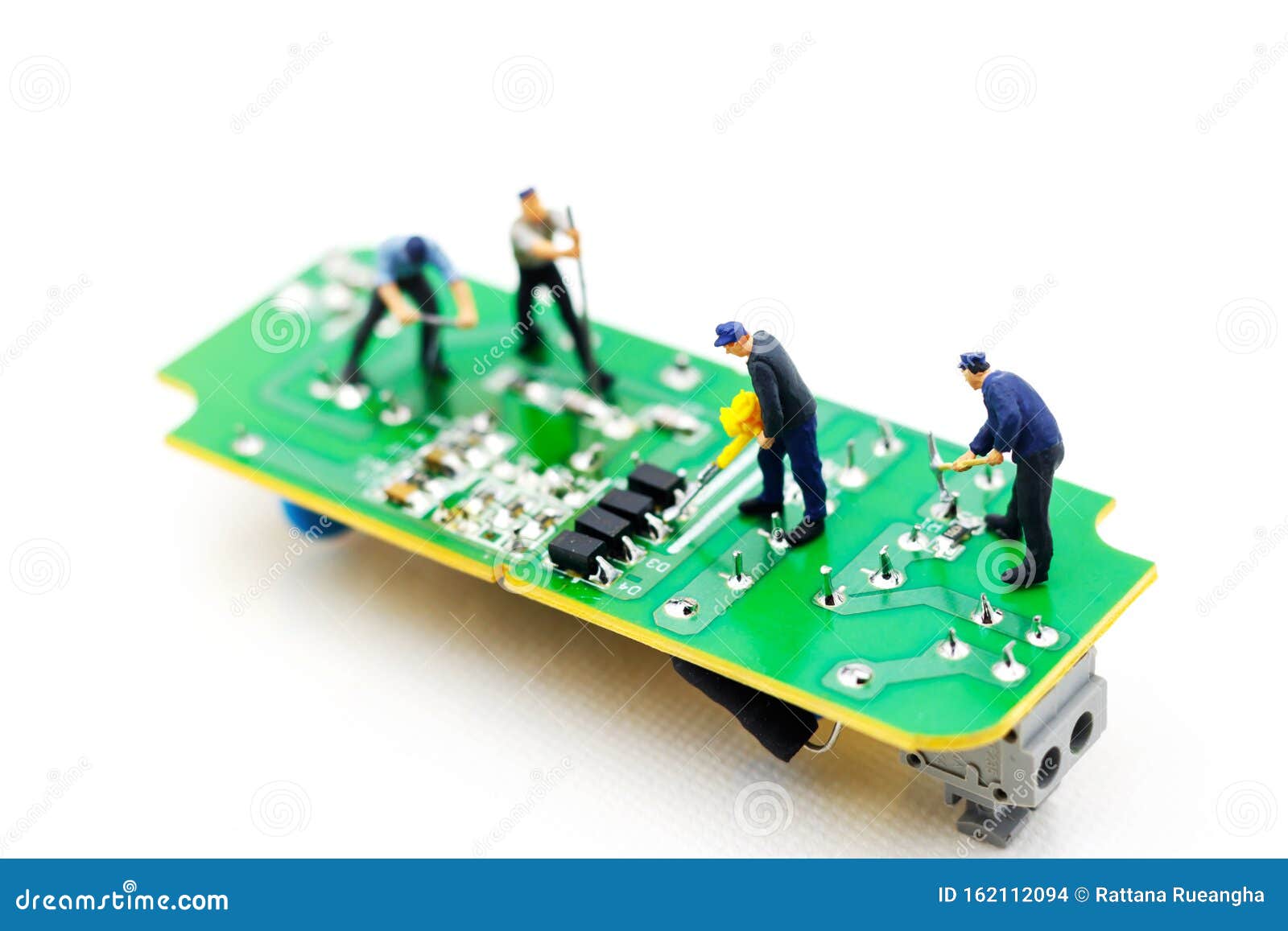 Miniature People: Engineers Fixing Error on Chip of Circuit Board ...