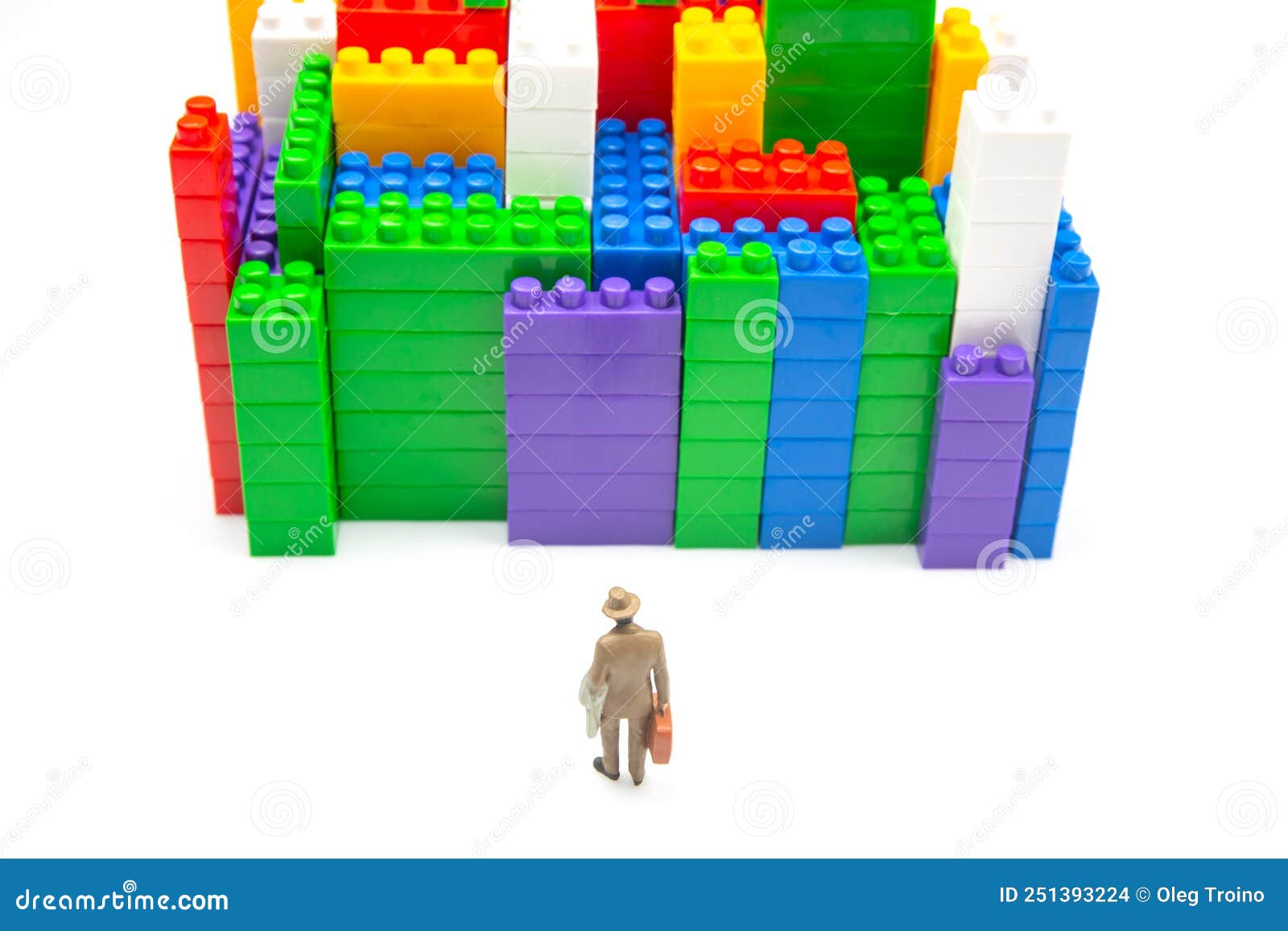 Miniature People. Figures of People Stand Near the Colored Blocks of a ...