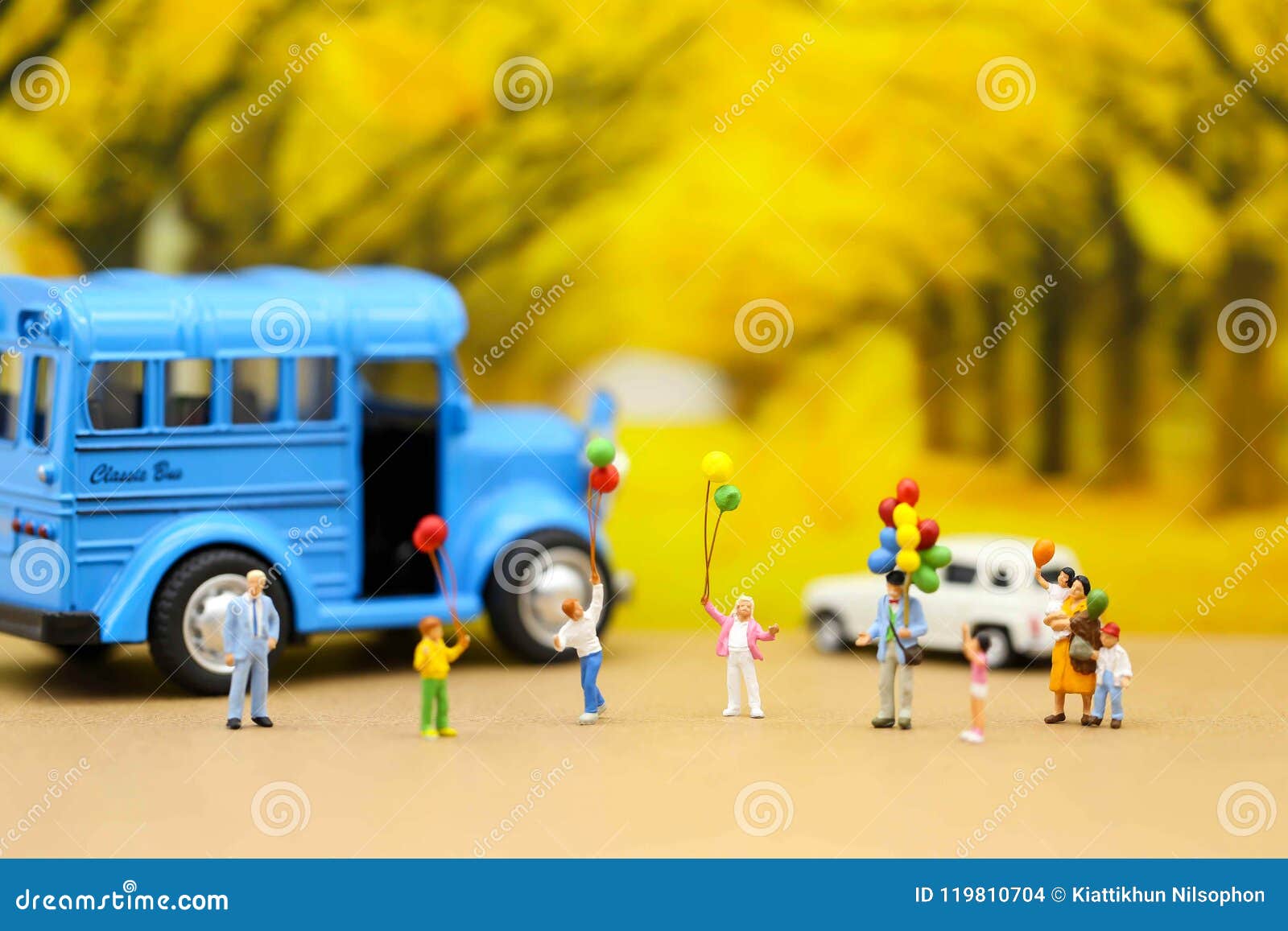 Miniature People : a Group of Young Children Getting on the Schoolbus ...