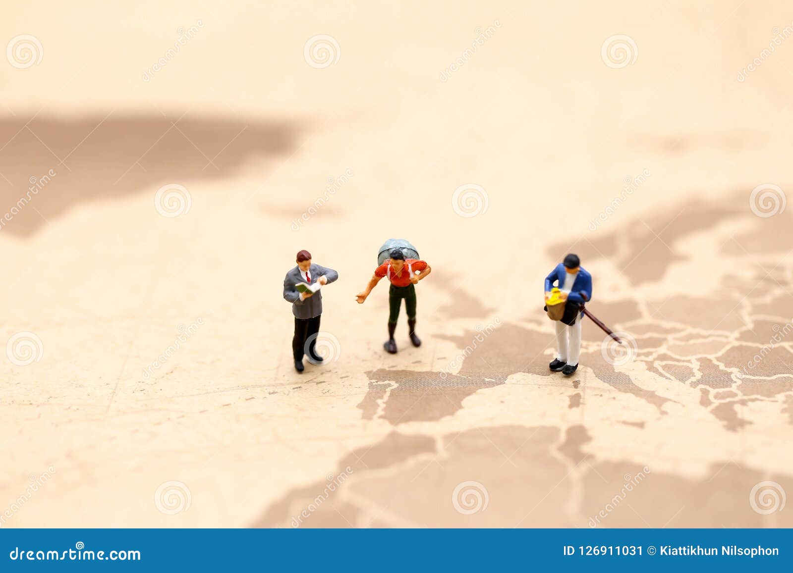 Miniature People : Traveler Reading a Map Using Concept of Map R Stock ...