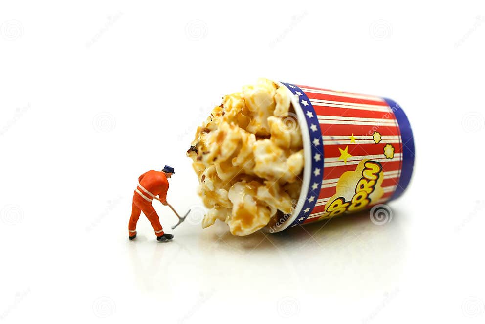 Miniature People : Worker Digging with Popcorn. Stock Photo - Image of ...