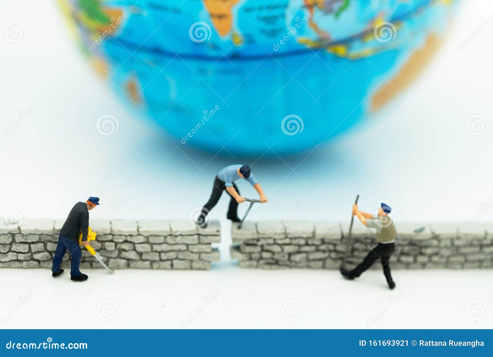 Miniature People: Worker Fix the Wall before the World. Concepts of ...