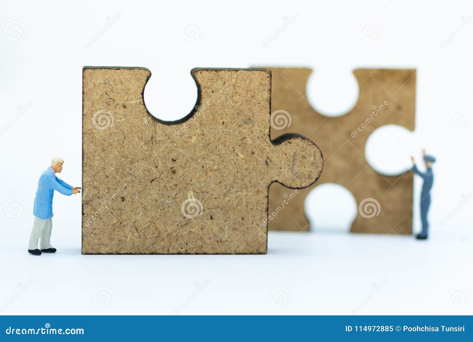 Miniature People : Worker Pushing Back Jigsaw Puzzle Pieces . Image Use ...