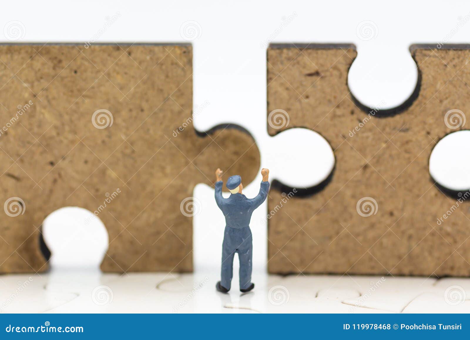 Miniature People : Worker Pushing Back Jigsaw Puzzle Pieces . Image Use ...