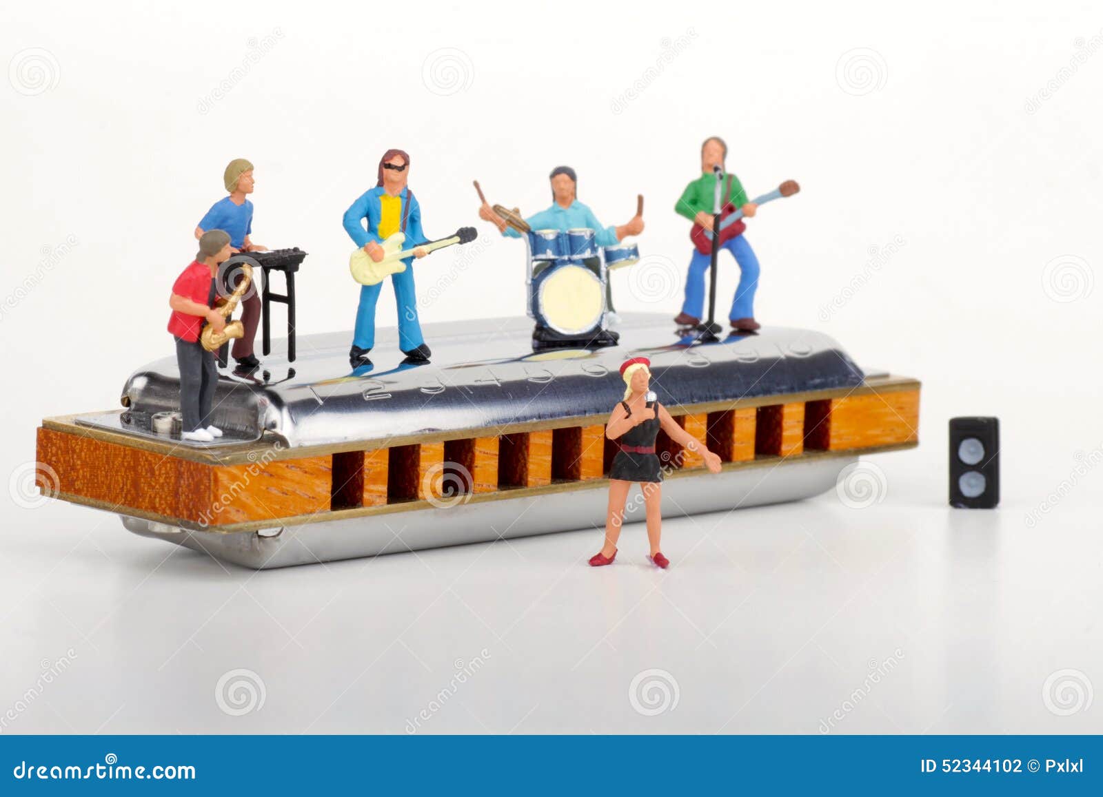 Miniature of a Rock Band Playing on the Harmonica Stock Photo - Image ...