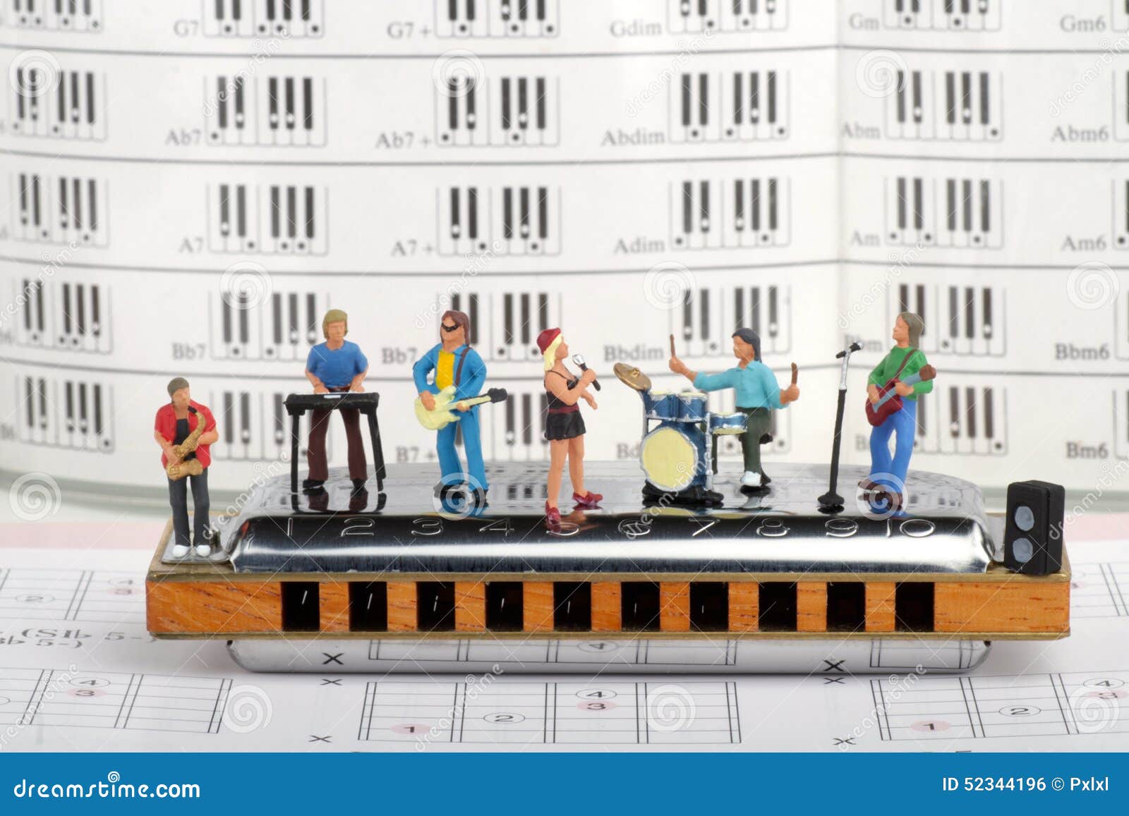 Miniature of a Rock Band Playing on the Harmonica Stock Photo - Image ...