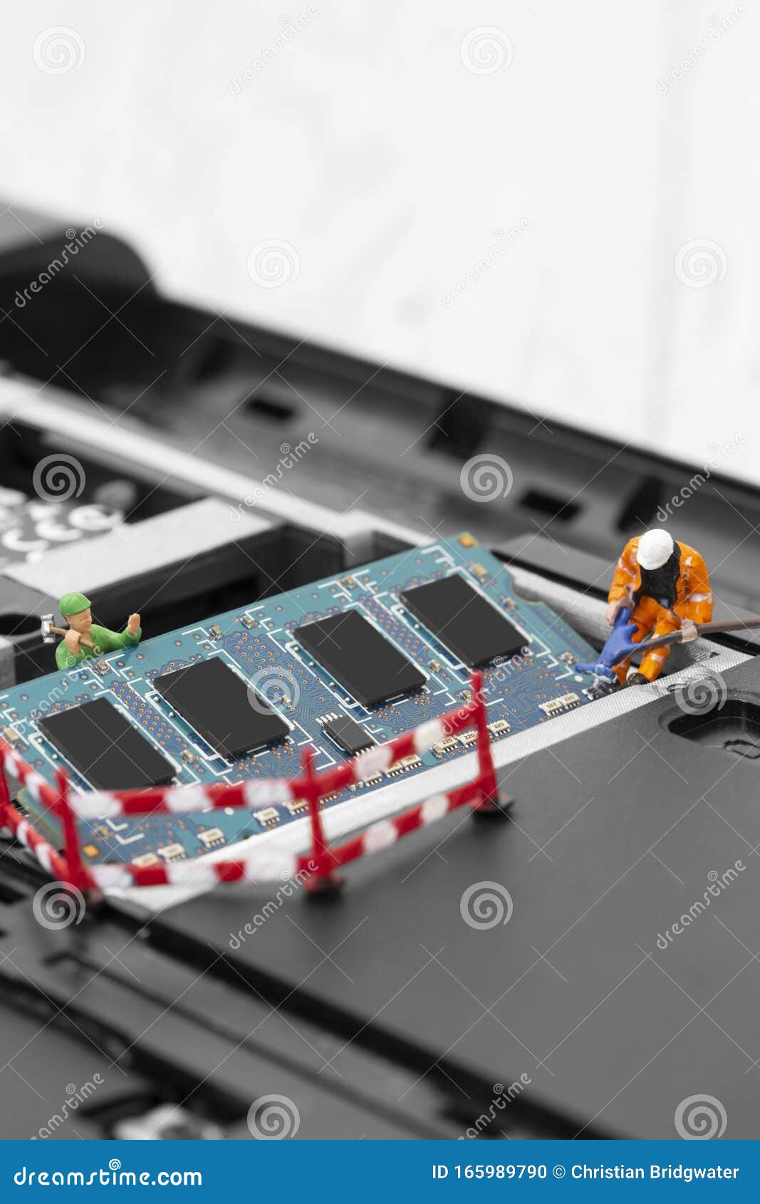 Miniature Scale Model Construction Workers Installing RAM into the Slot ...