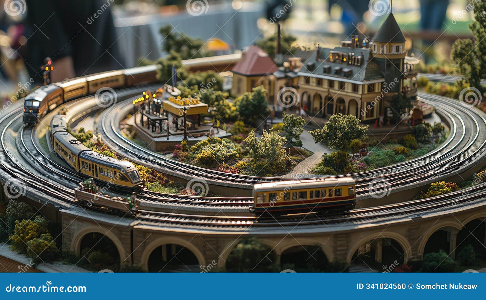 A Miniature Train Set with a Circular Track and Buildings Stock ...