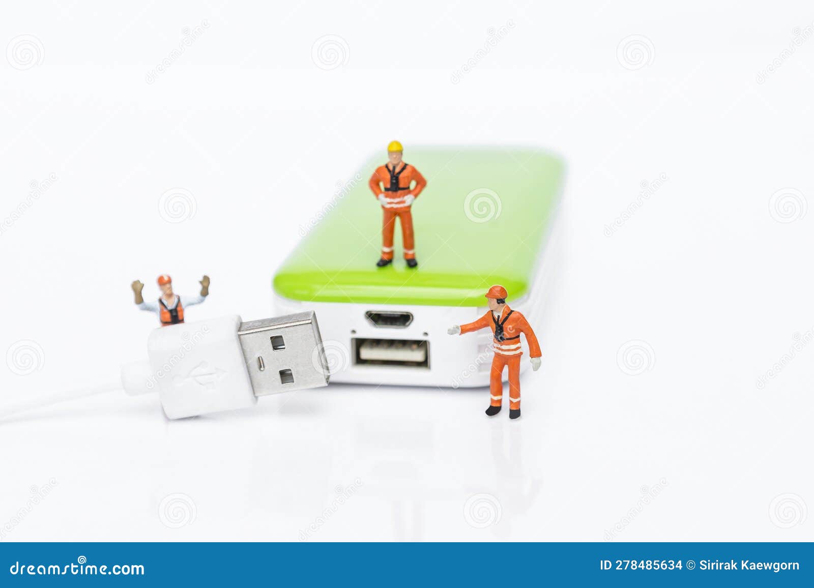 Miniature Worker with USB Cable and Power Bank Isolate on White ...