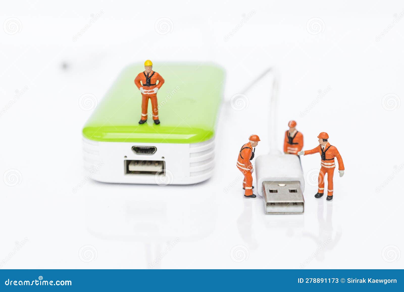 Miniature Worker with USB Cable and Power Bank Isolate on White ...