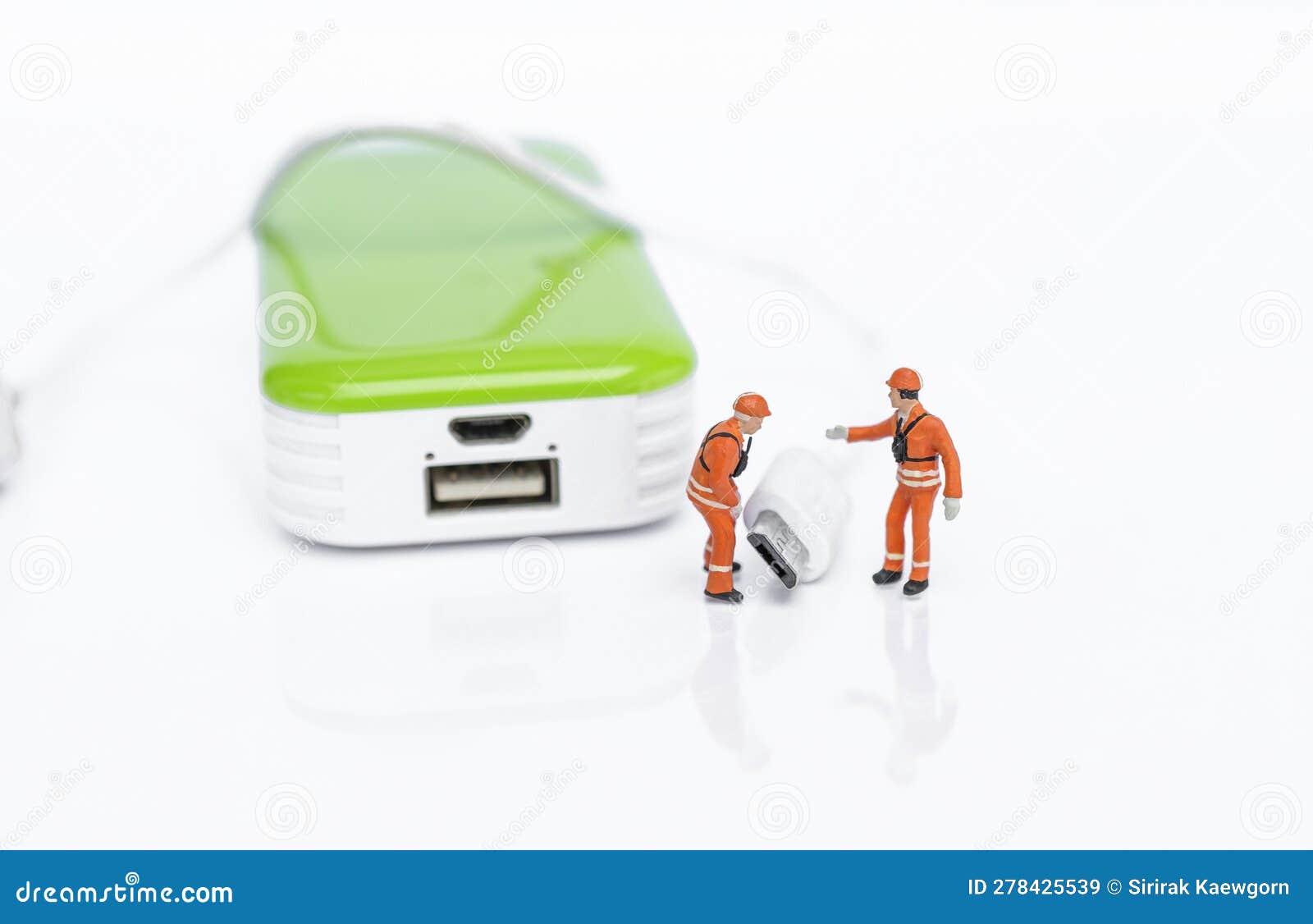 Miniature Worker with USB Cable and Power Bank Isolate on White ...
