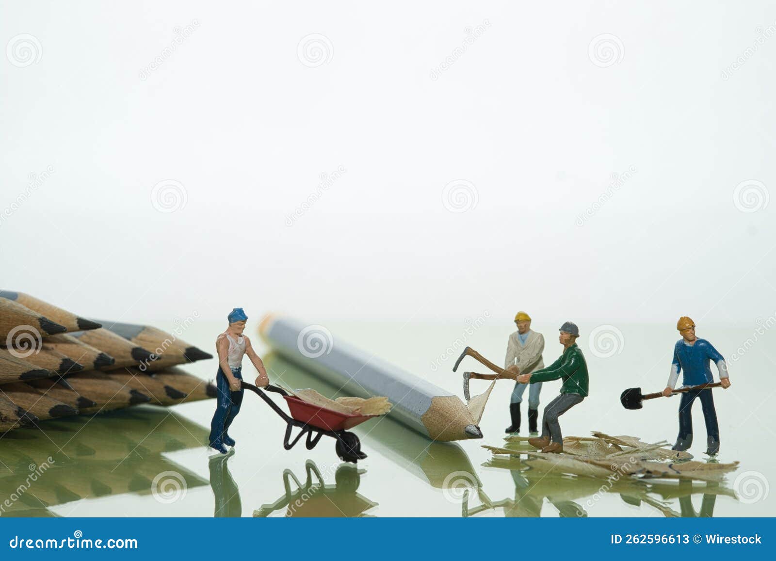 Miniature Workers Sharpen a Pencil with a Pickaxe Stock Image - Image ...