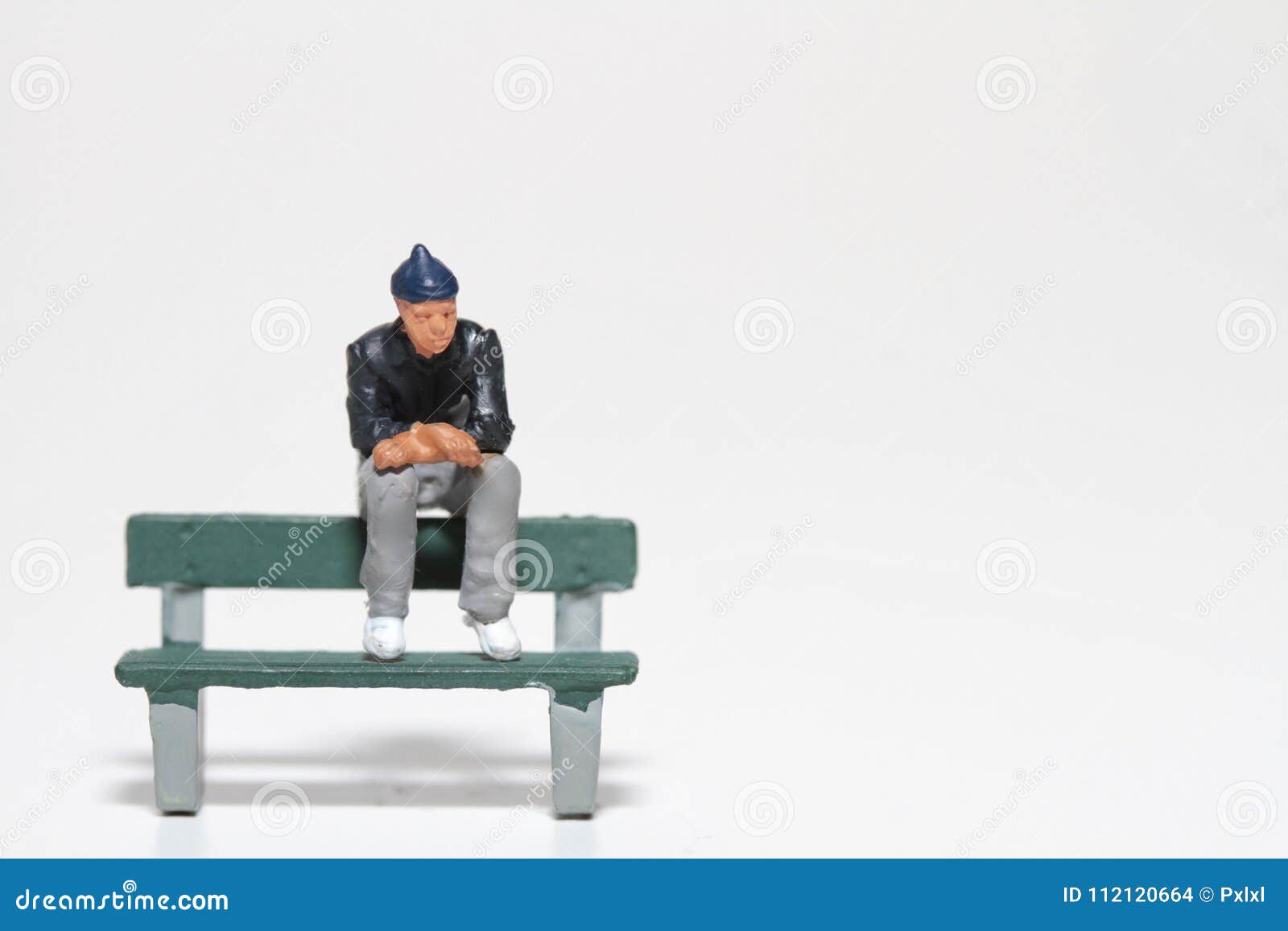 Miniature of a Man Sitting on a Bench Stock Photo - Image of ...