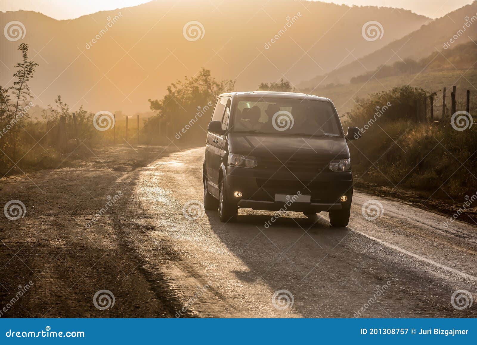 Minibus Moves Along a Winding Road in Sunlight Stock Image - Image of ...