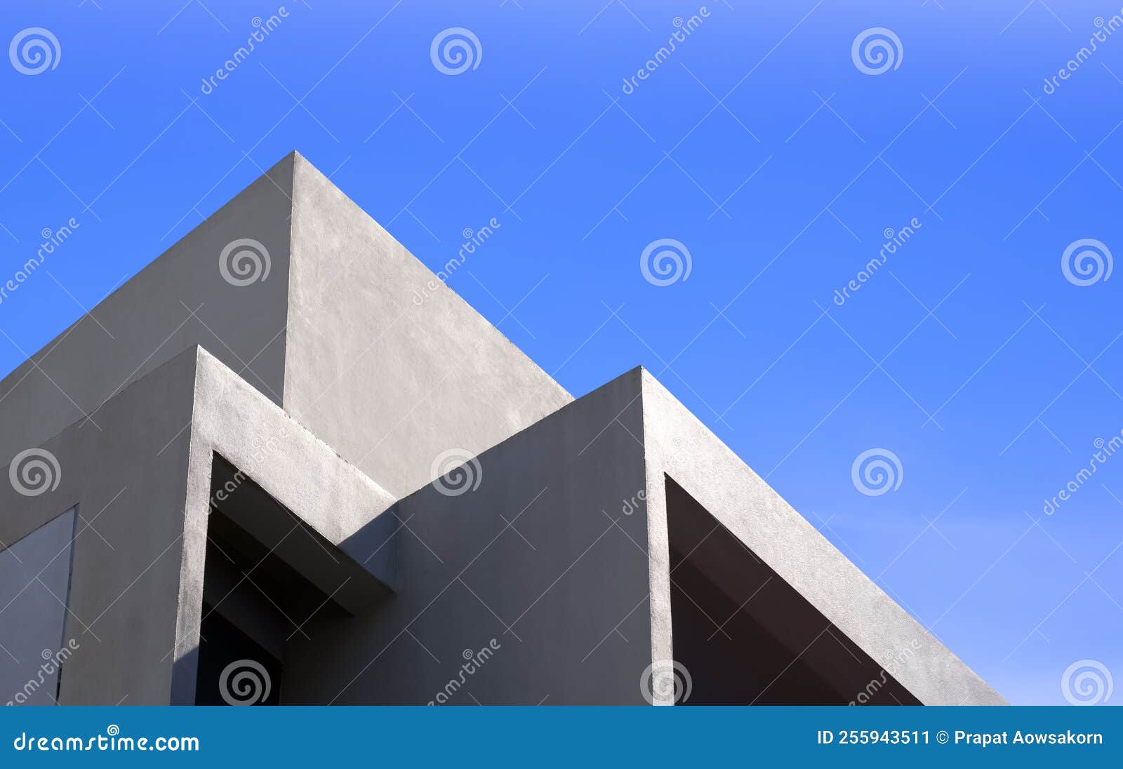 Modern Beige Building Against Blue Sky in Low Angle and Perspective ...