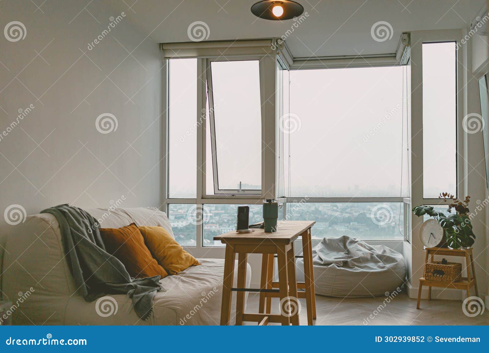 Minimal and Loft Living Room Design with Iced-coffee and Computer in ...