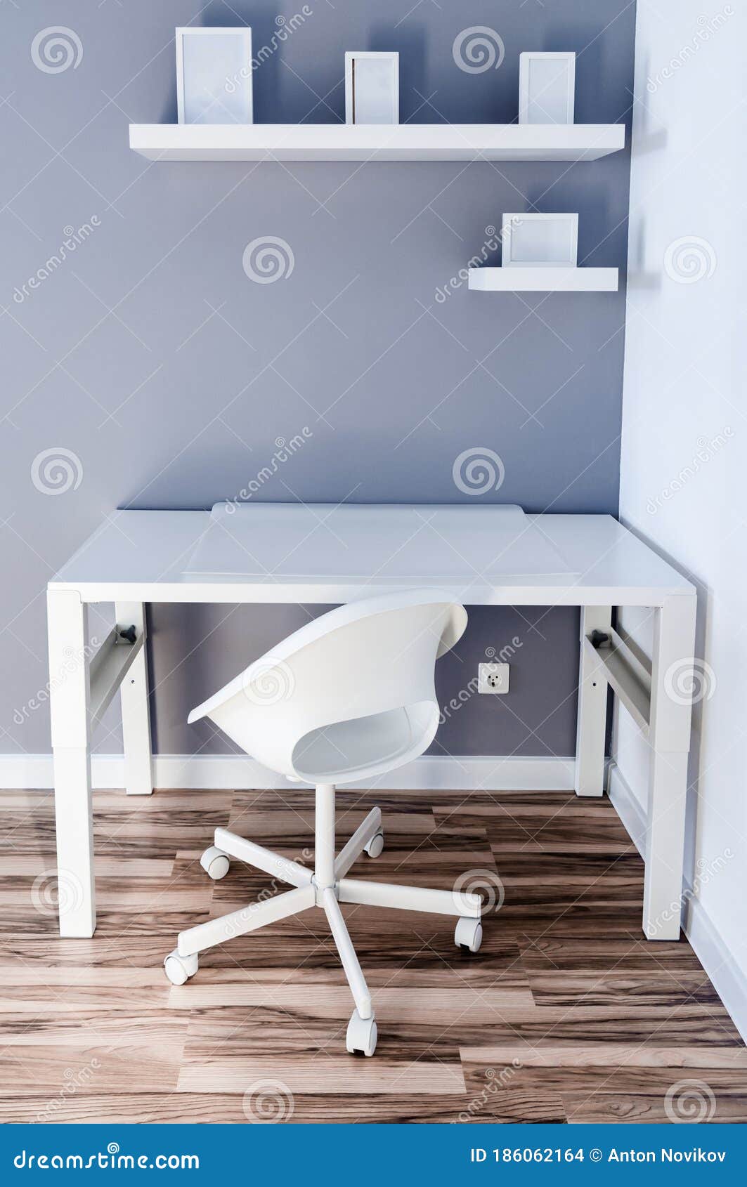 Empty Workplace with White Table and Shelves with Frames for Photos ...