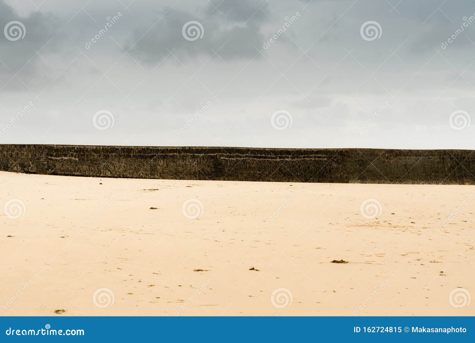 Minimalist Abstract Landscape of Stone Harbor Wall and Beach Under an ...