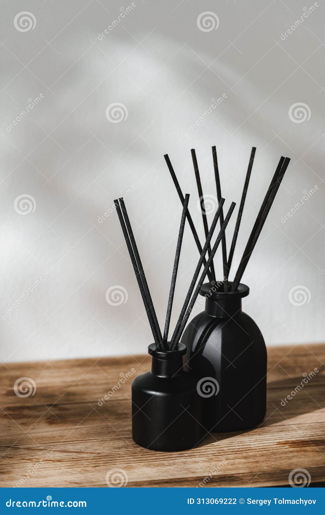 Minimalist Aromatic Reed Diffusers on a Wooden Surface Against a Soft ...