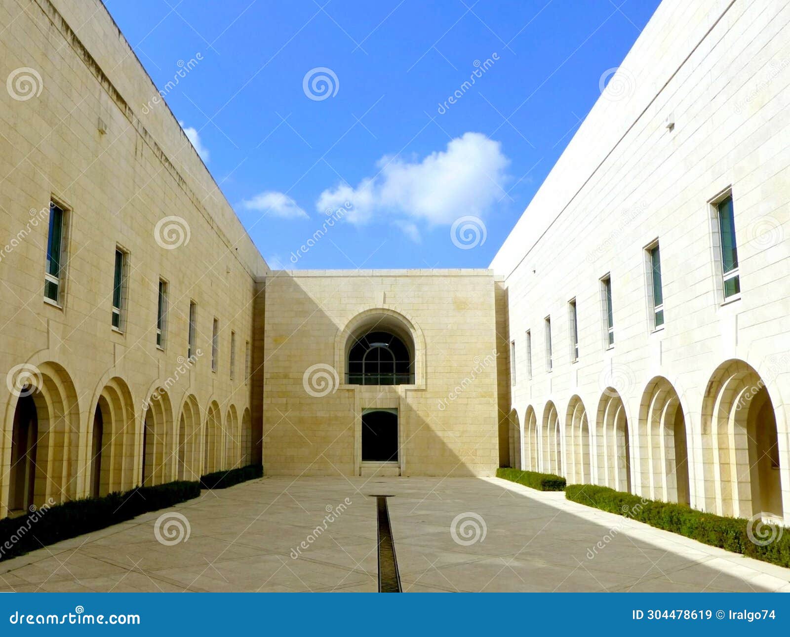 Minimalist Courtyard Design of a Public Building with Arches and ...