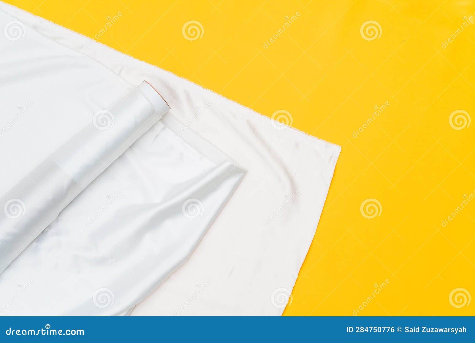 The Minimalist Design Accentuates the Beauty of a Glossy White Fabric ...